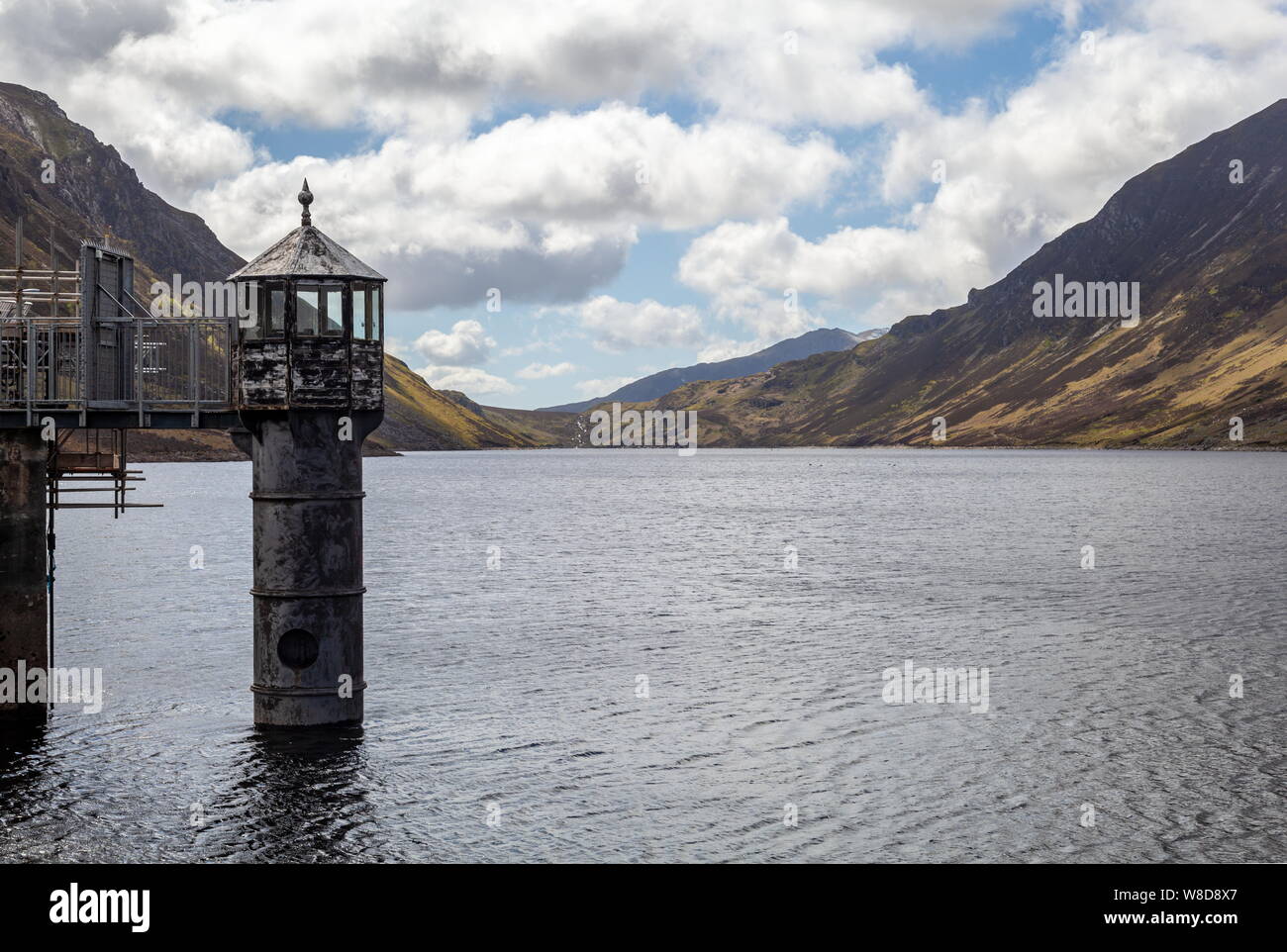 Looking down the length of Llyn Cowlyd reservoir from the dam, which ...