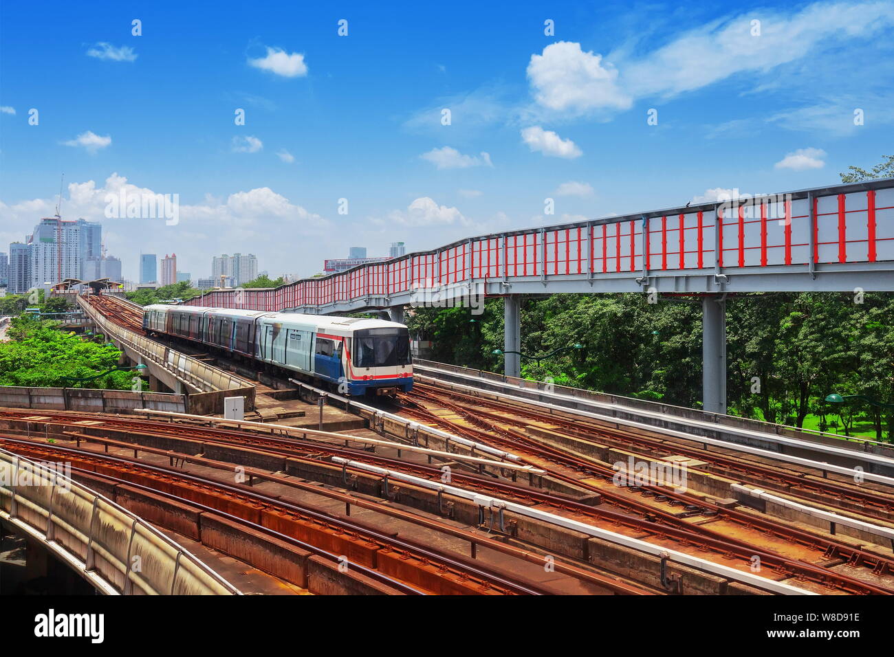 Trains traveling on elevated rails of BTS Metro System Thailand ...