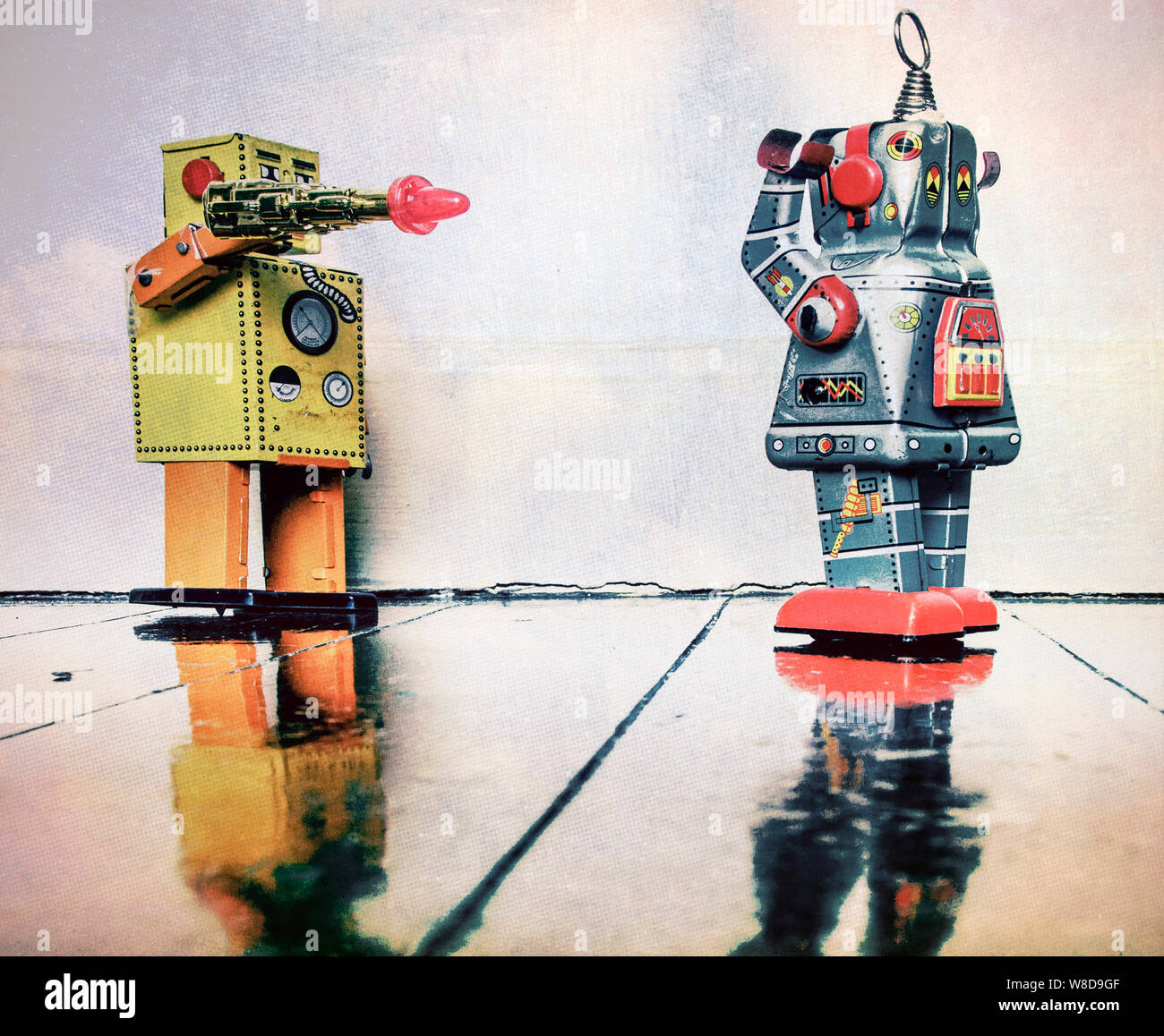 concept gun crime with retro toy robots on a wooden floor Stock Photo ...