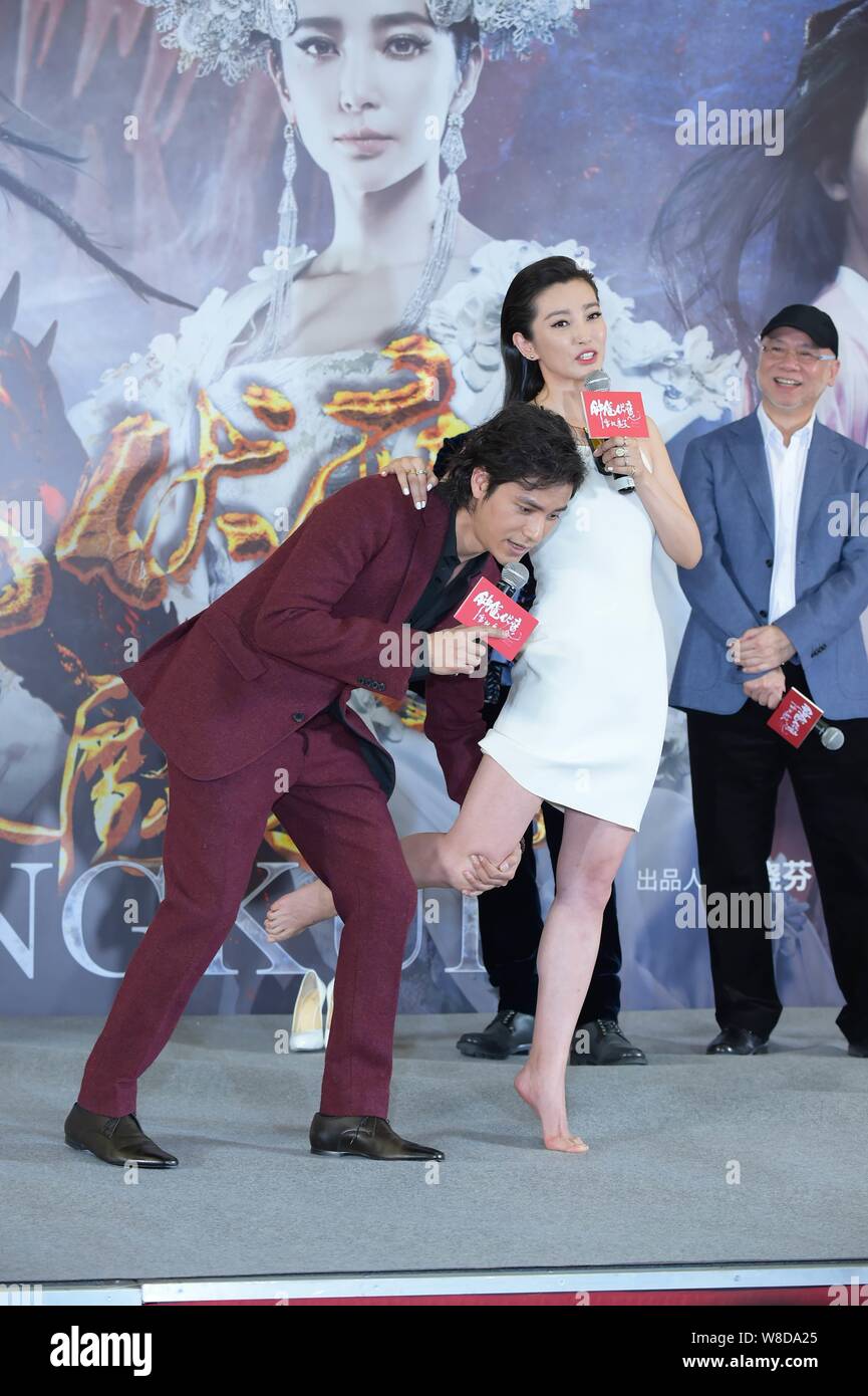 Chinese actor Chen Kun, left, tries to hold up actress Li Bingbing at a ...