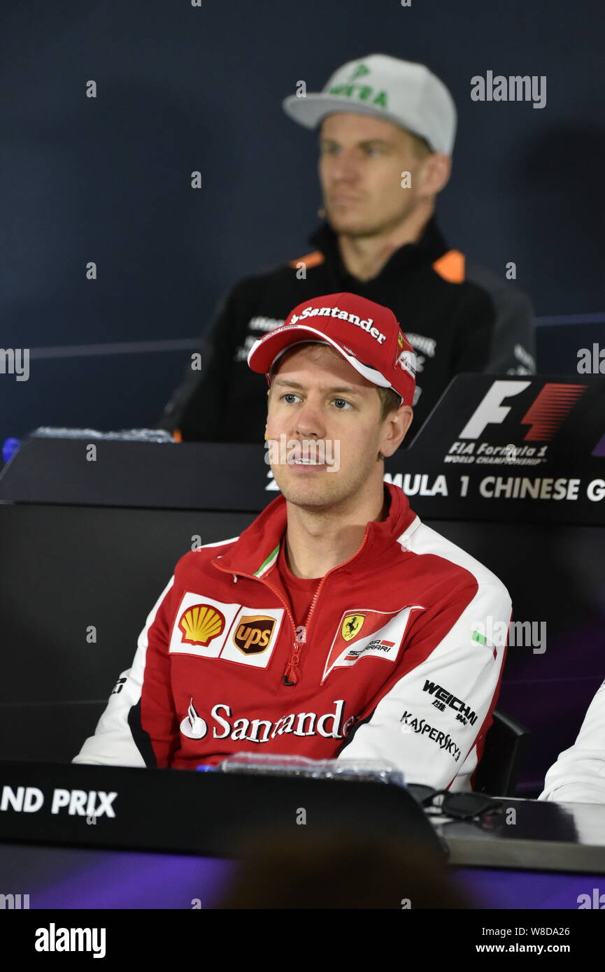 German F1 driver Sebastian Vettel of Ferrari, front, and German F1 ...