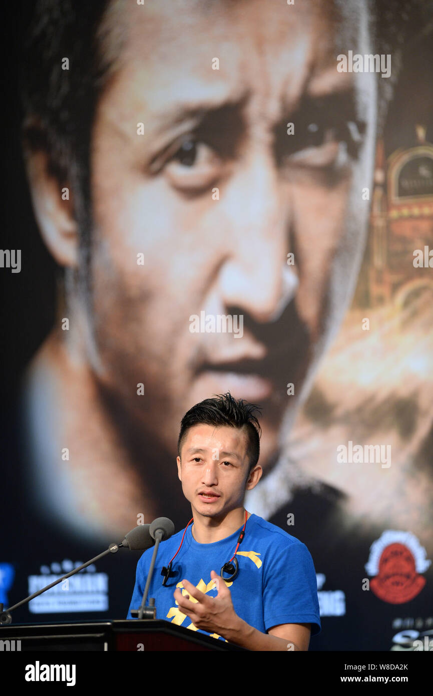 Zou Shiming of China speaks at a press conference after losing to Amnat ...