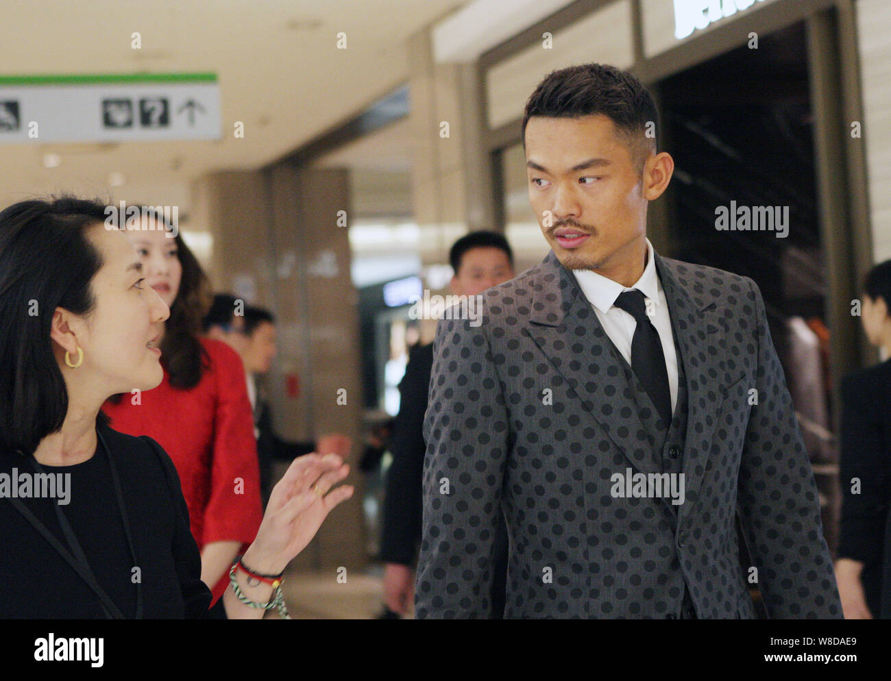 Chinese badminton star Lin Dan attends a signing event for his photo ...