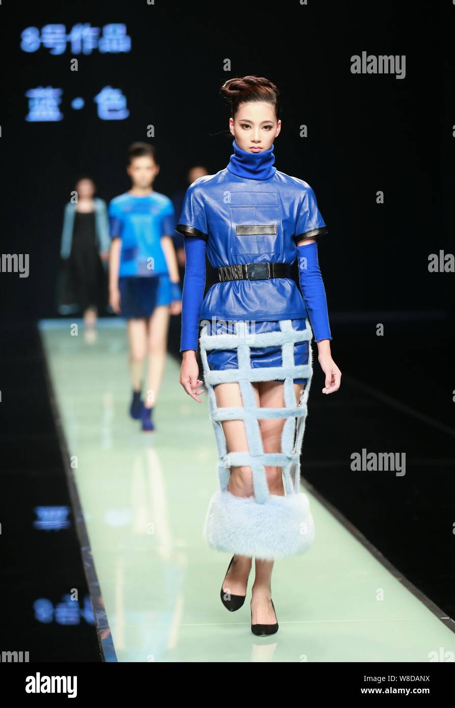 A model displays a new creation at the final contest of the 18th ...