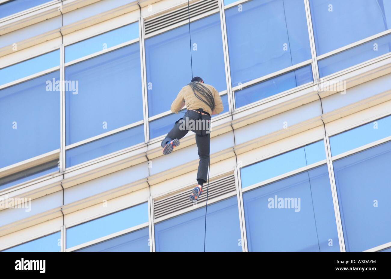 British adventurer and television presenter Bear Grylls abseils from a ...