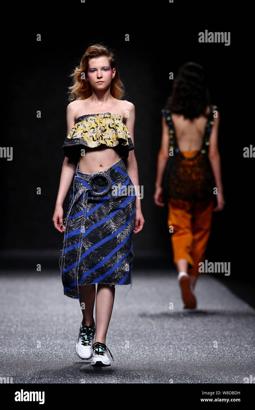 A model displays a new creation at the Nicole Zhang fashion show during ...