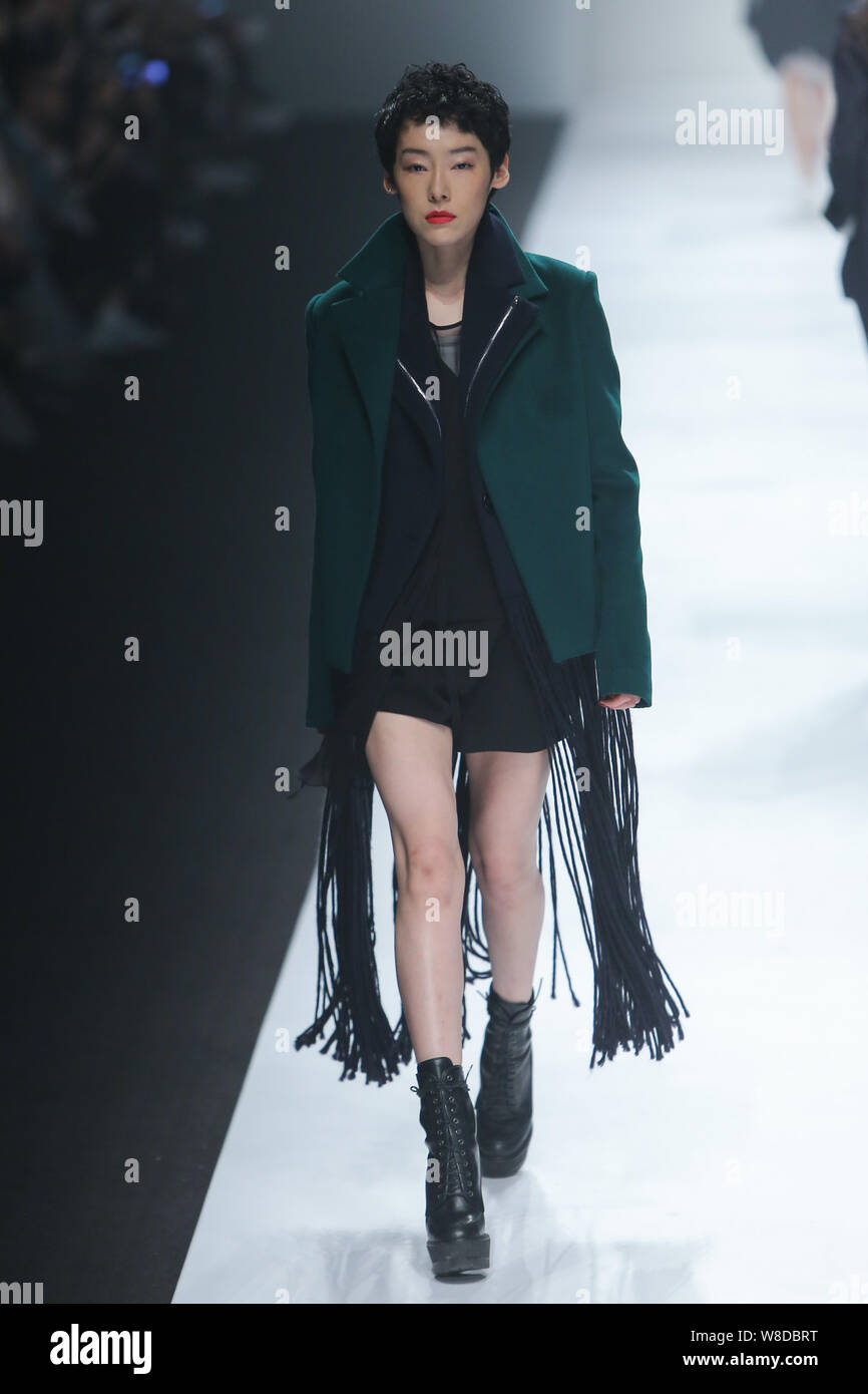 Japanese model Sayo Akasaka displays a new creation at the Jade En Plus ...
