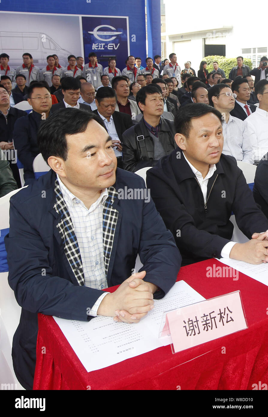 --FILE--Xie Xinsong, left, deputy mayor of Kunming city, attends an off-line ceremony at an auto ...