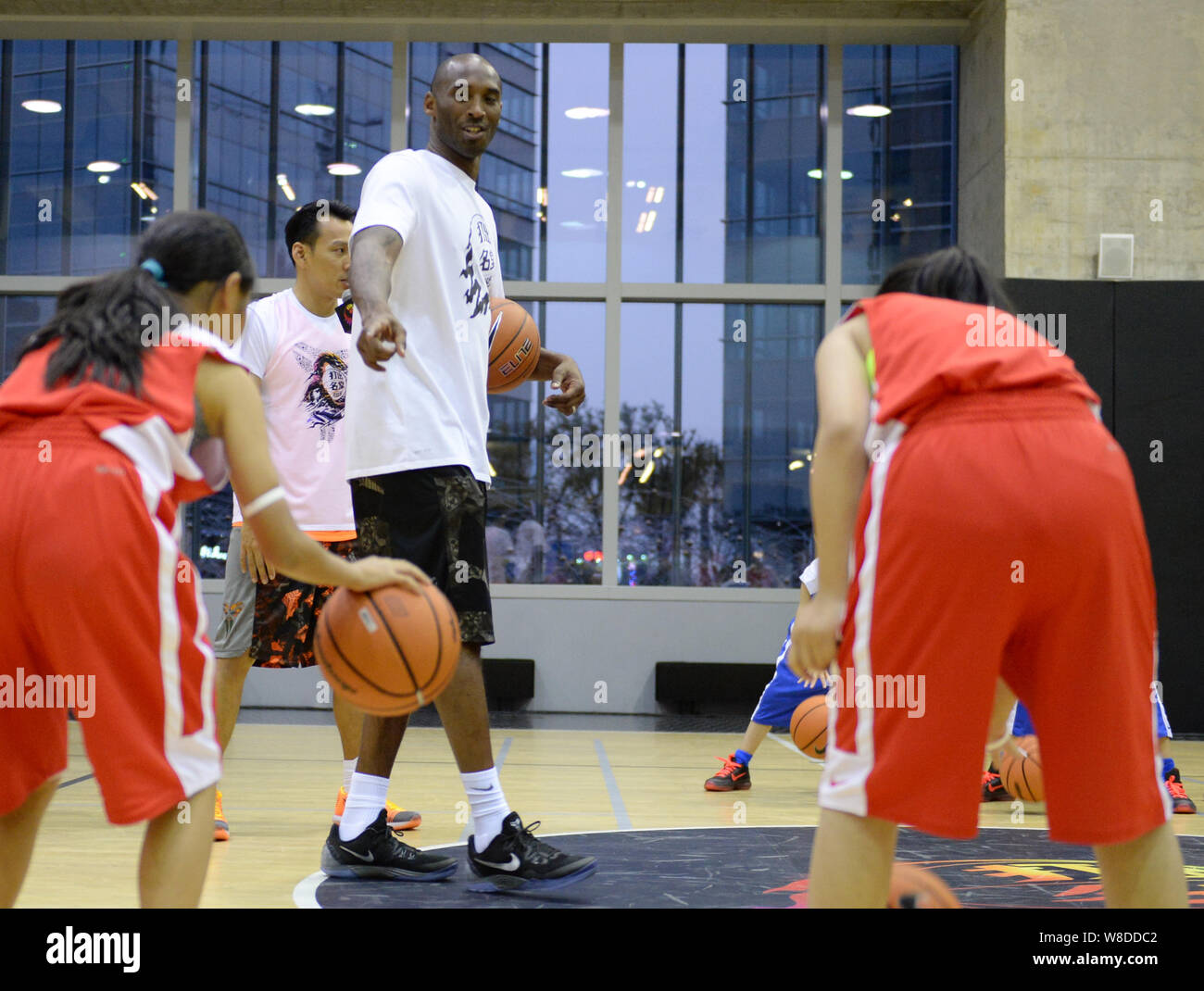 NBA basketball star Kobe Bryant instructs Chinese children at a ...