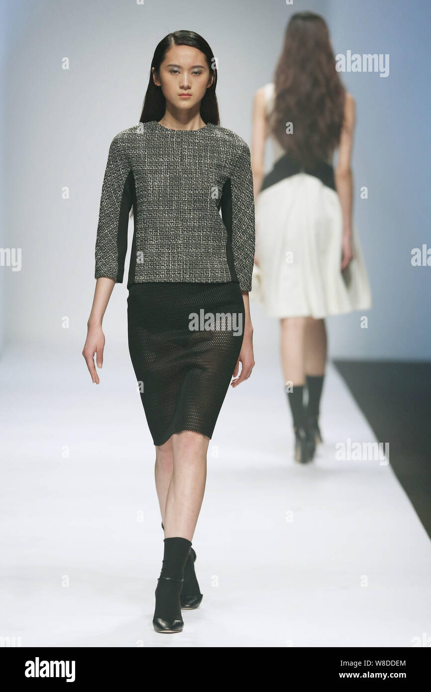 A model displays a new creation by Chinese fashion designer Han Lulu at ...