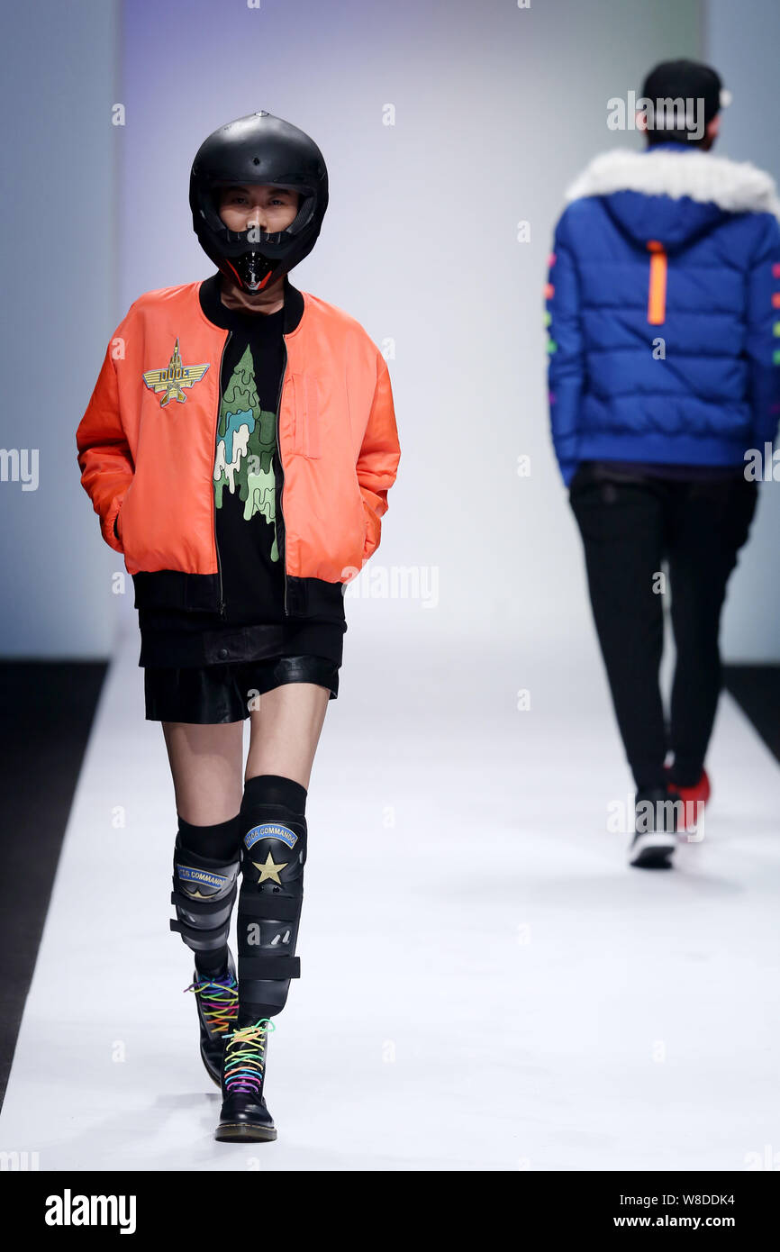 A model displays a new creation at Hong Kong singer and actor Leo Ku ...