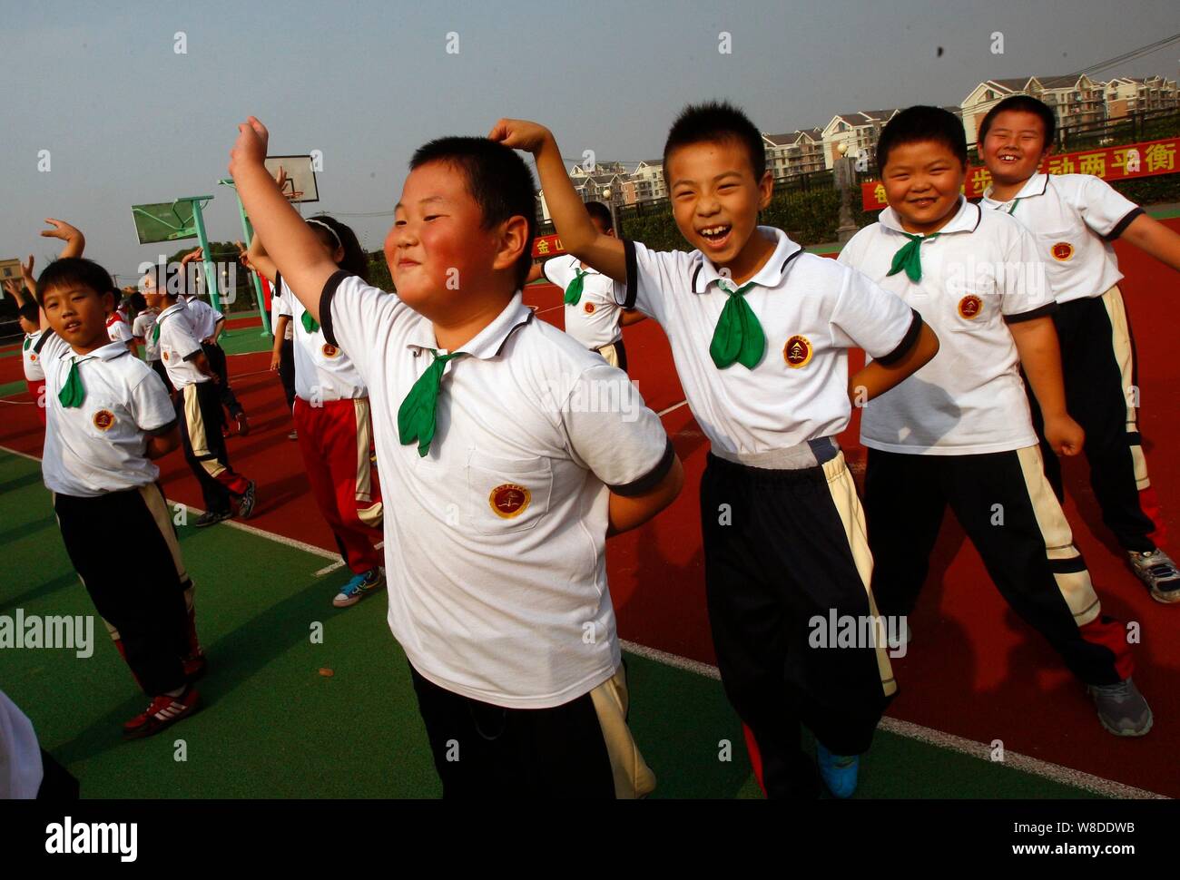 --FILE--Young Chinese students do physical exercises during a citywide ...