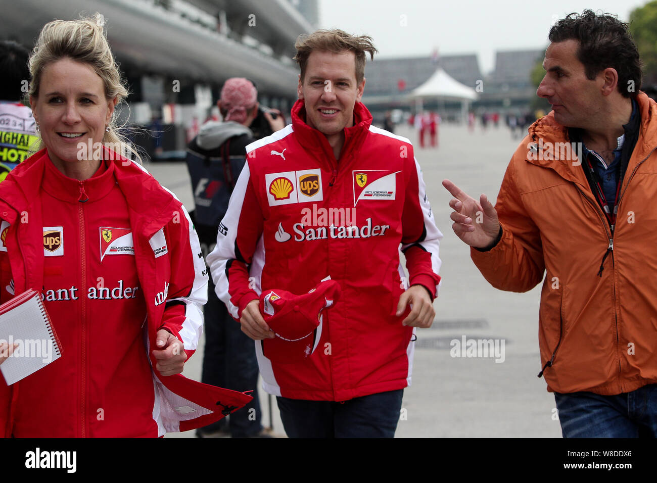 German F1 driver Sebastian Vettel of Ferrari, center, arrives at the ...