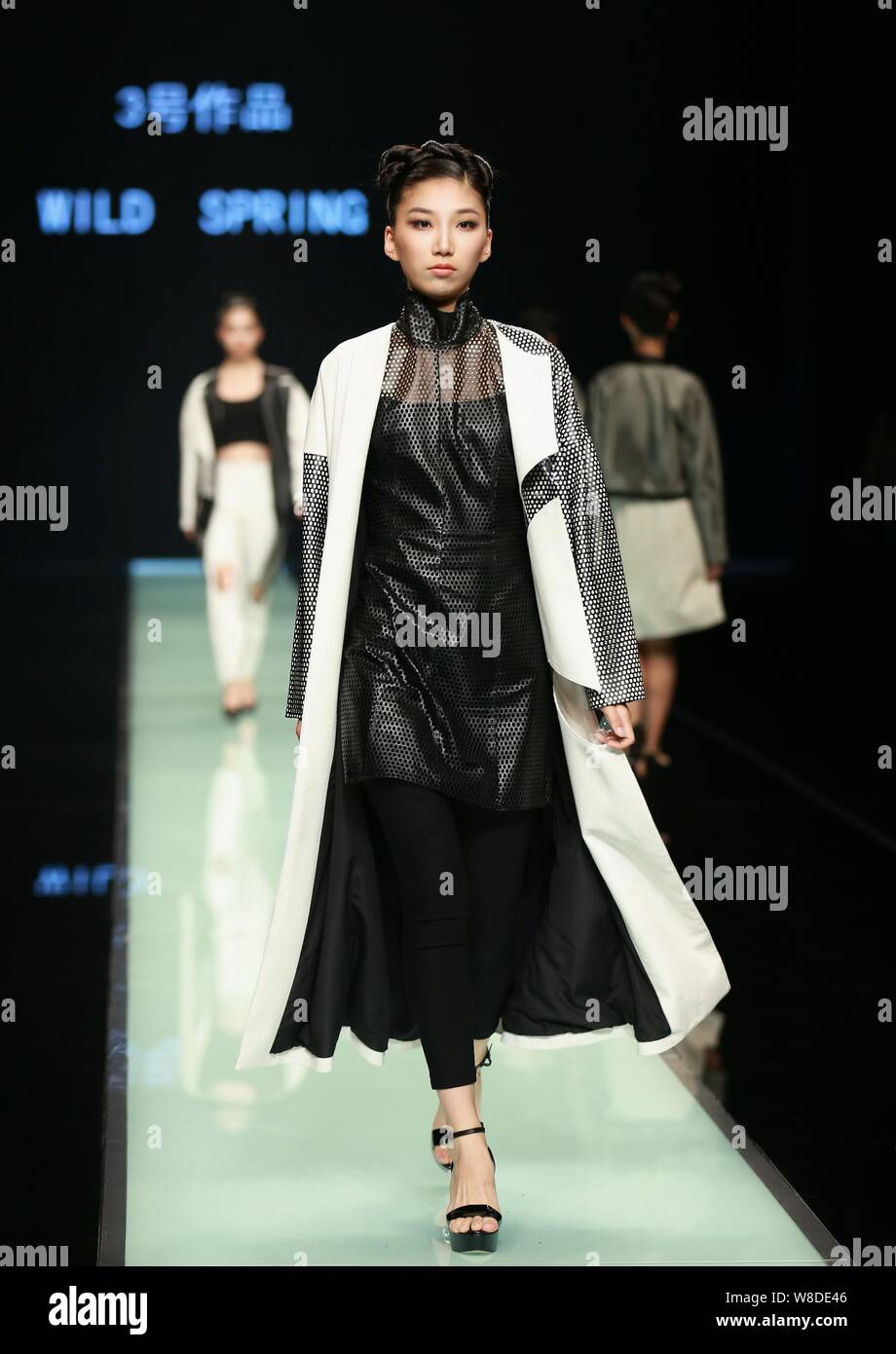 A model displays a new creation at the final contest of the 18th ...