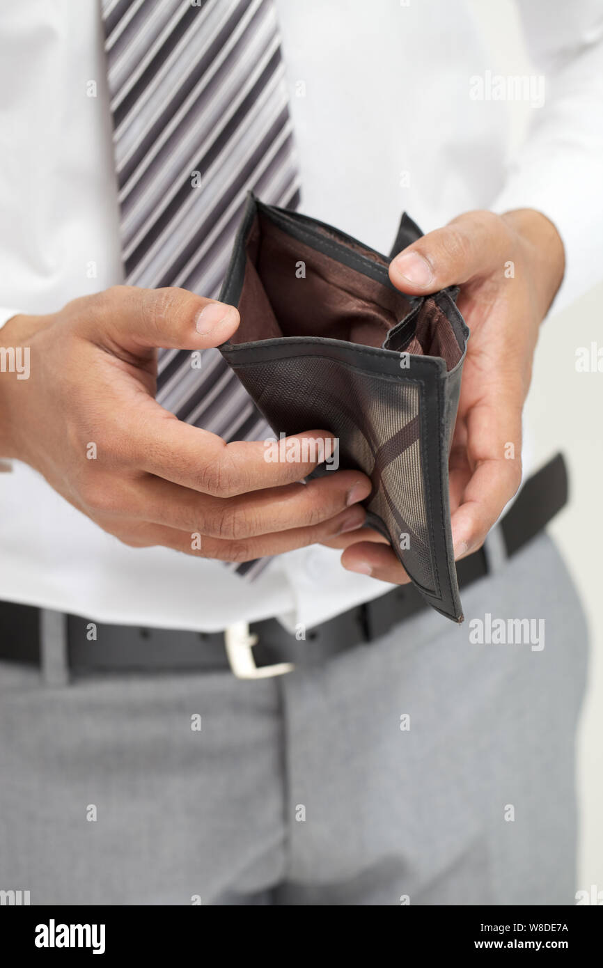 Midsection of a businessman showing empty wallet Stock Photo - Alamy