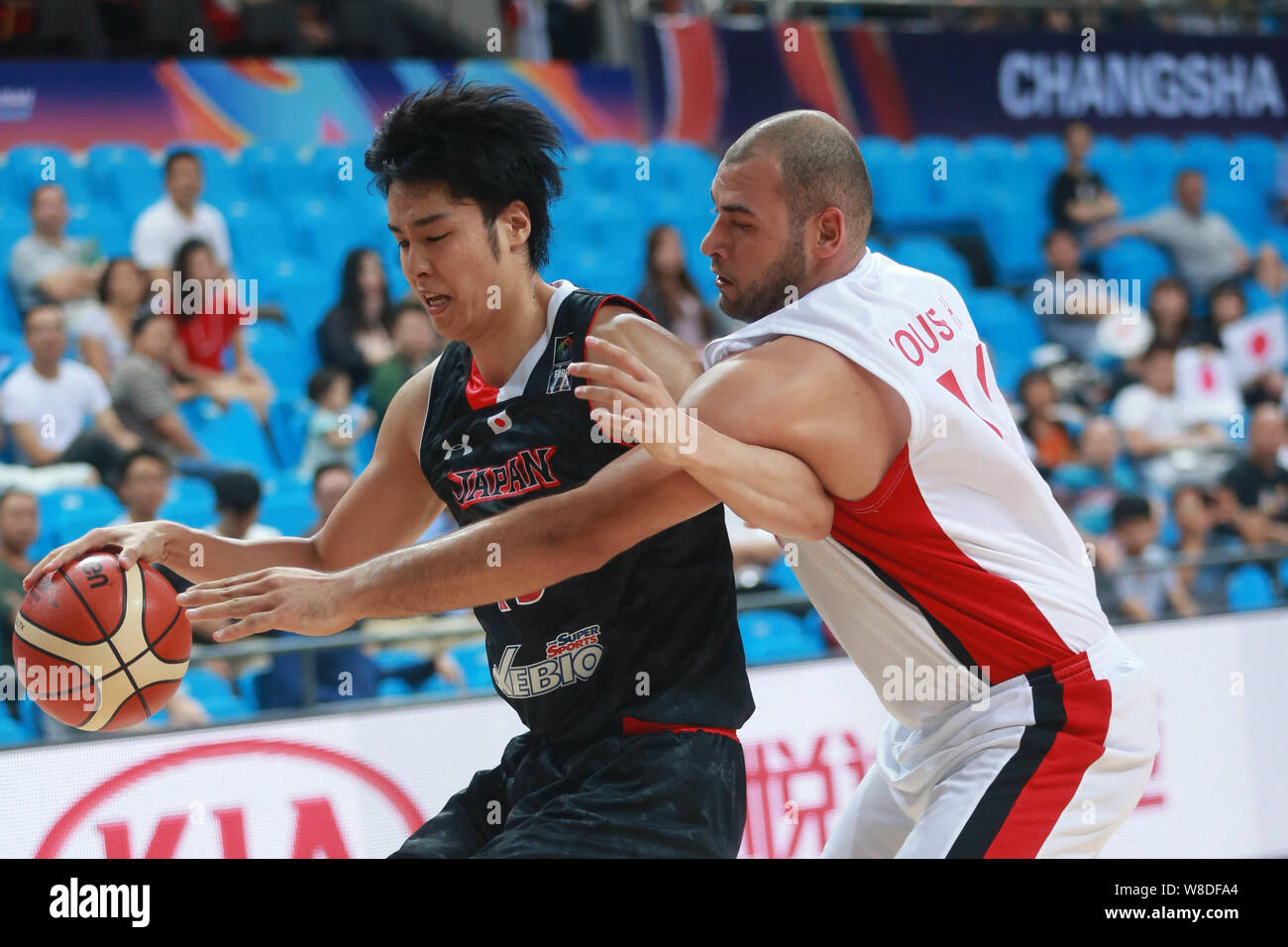 Hamza Yousef of Palestine, right, challenges Joji Takeuchi of Japan in ...