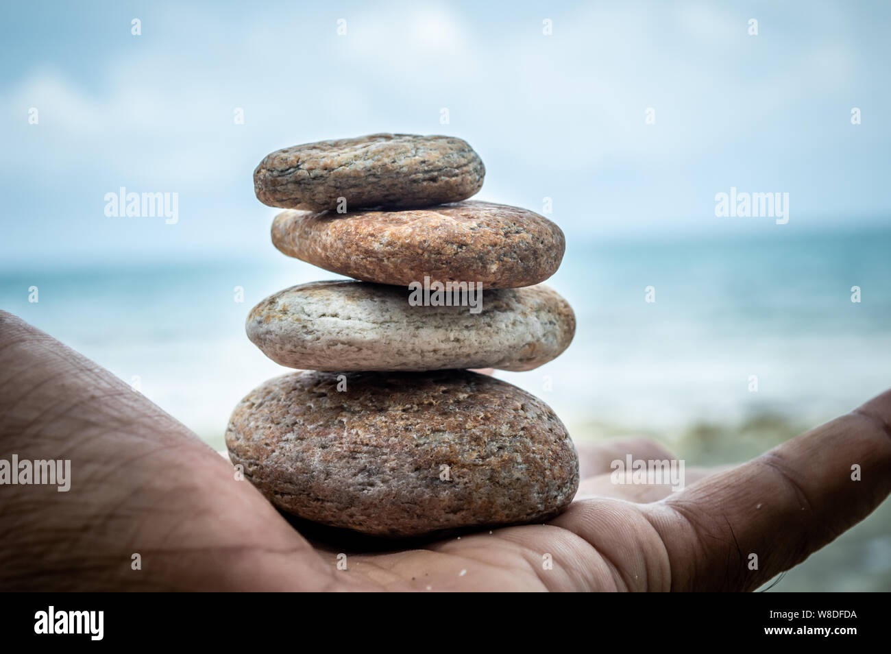 Rock on hand at the beach Koh Samet Stock Photo - Alamy