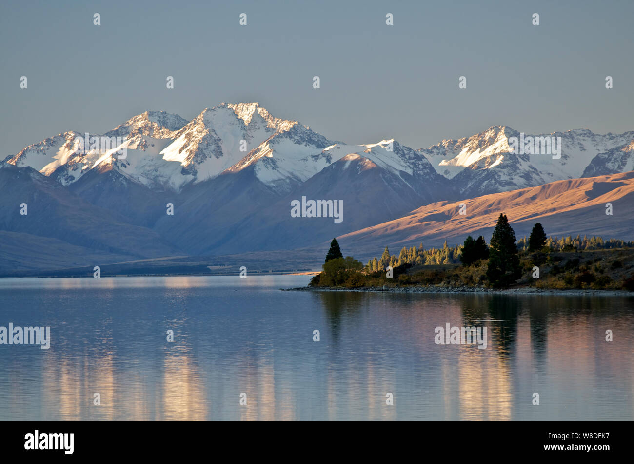 Landscape view across Lake Tekapo, New Zealand, towards mountain ranges ...