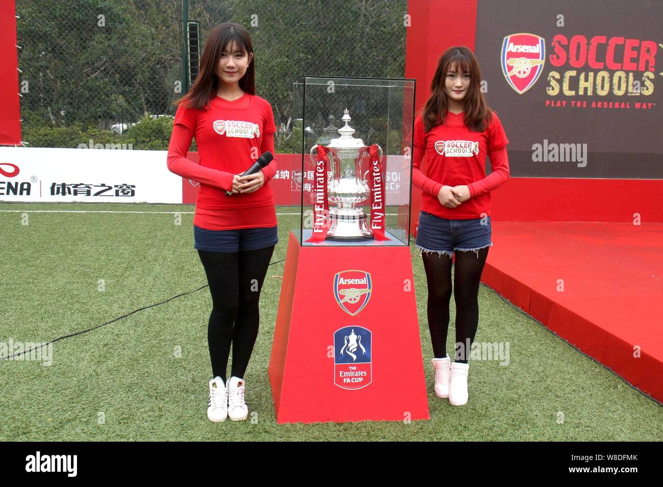 Chinese hostesses pose with the FA Cup Trophy during the Arsenal ...