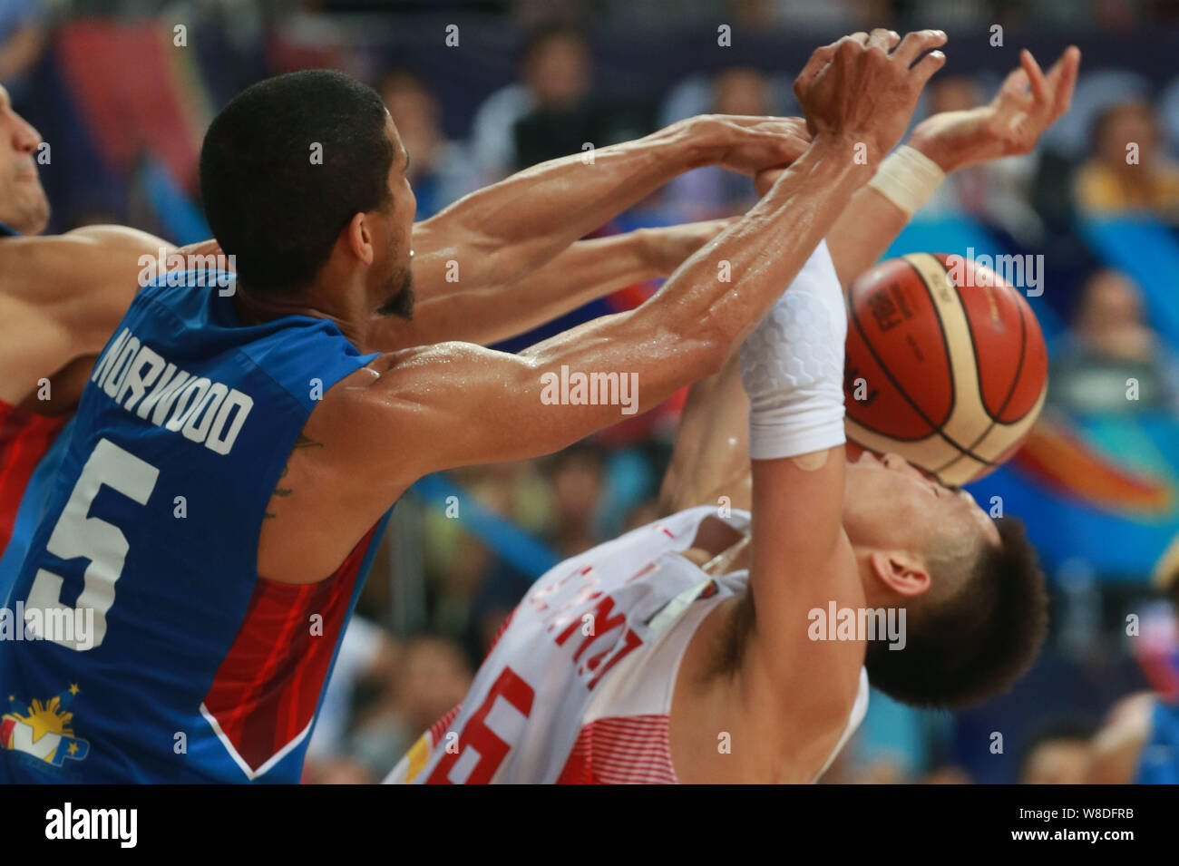 Gabriel Norwood of the Philippines, left, challenges Guo Ailun of China ...