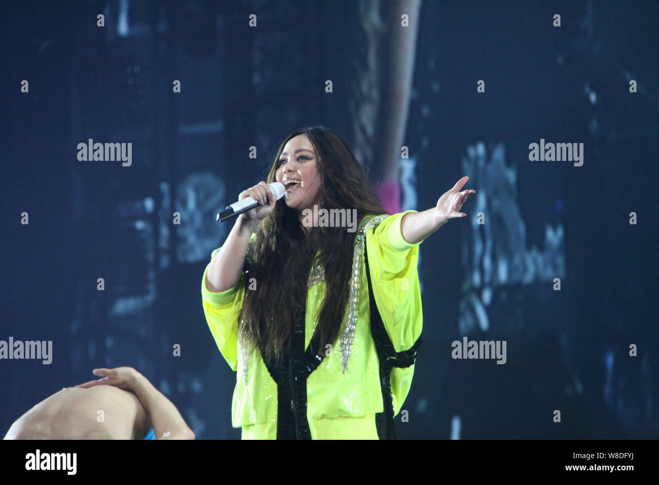 Taiwanese singer A Mei performs during her concert in Nanning city ...