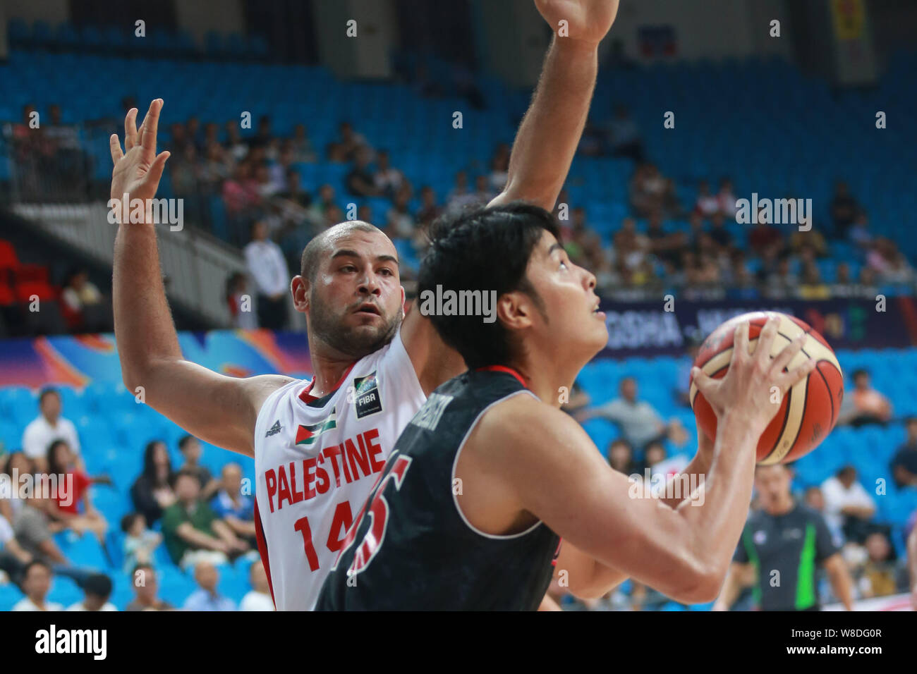 Joji Takeuchi of Japan, right, prepares to shoot against Hamza Yousef ...