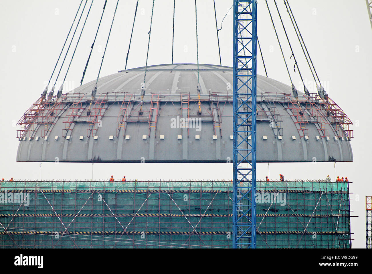 A containment dome for the No.2 reactor is being lifted and installed ...