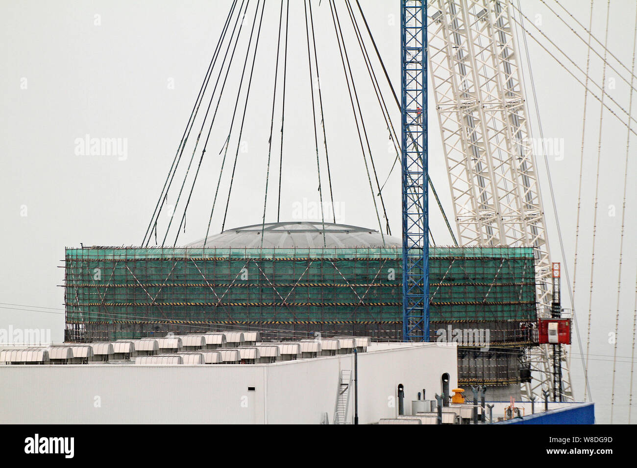 A containment dome for the No.2 reactor is being lifted and installed ...