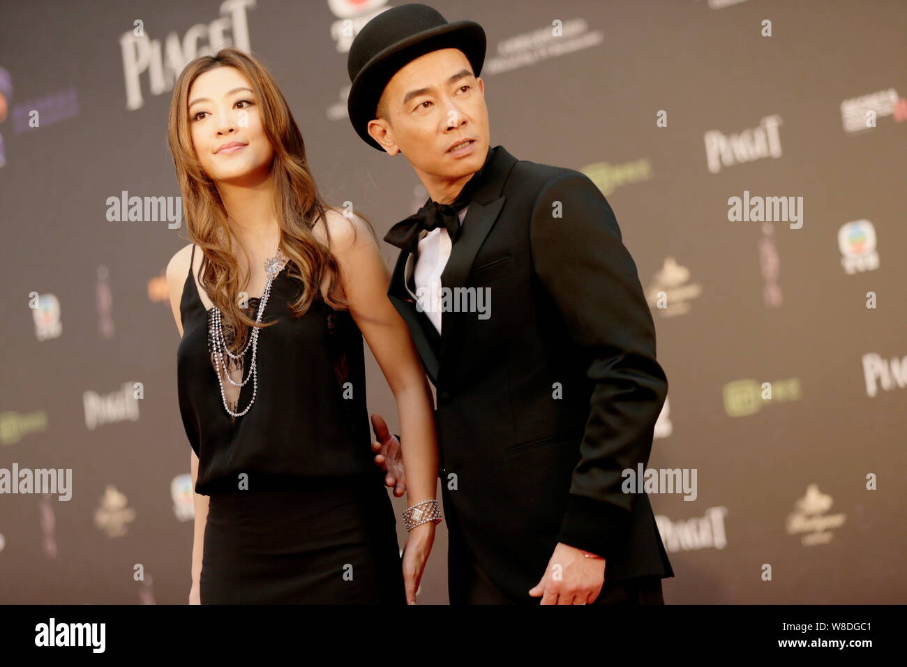 Hong Kong singer and actor Jordan Chan, right, and his actress wife ...