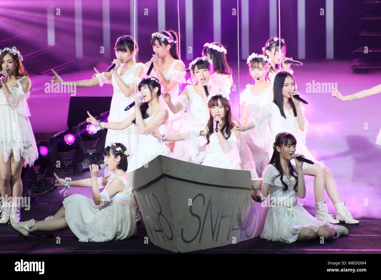 Members of idol group SNH48, a sister group of Japanese pop girl group AKB48, perform at the ...