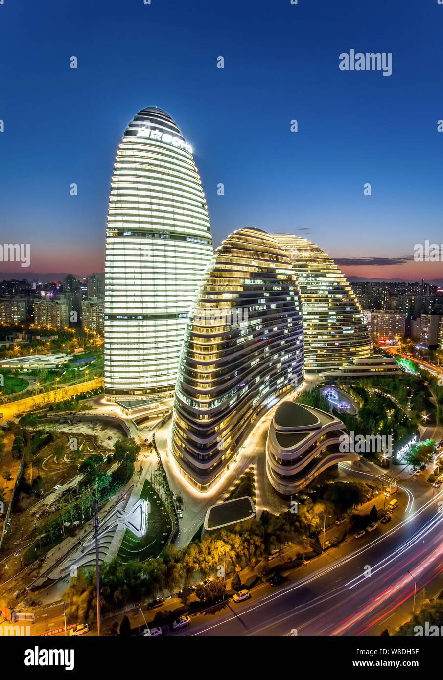 Night view of the Wangjing Soho developed by Soho China in Beijing ...