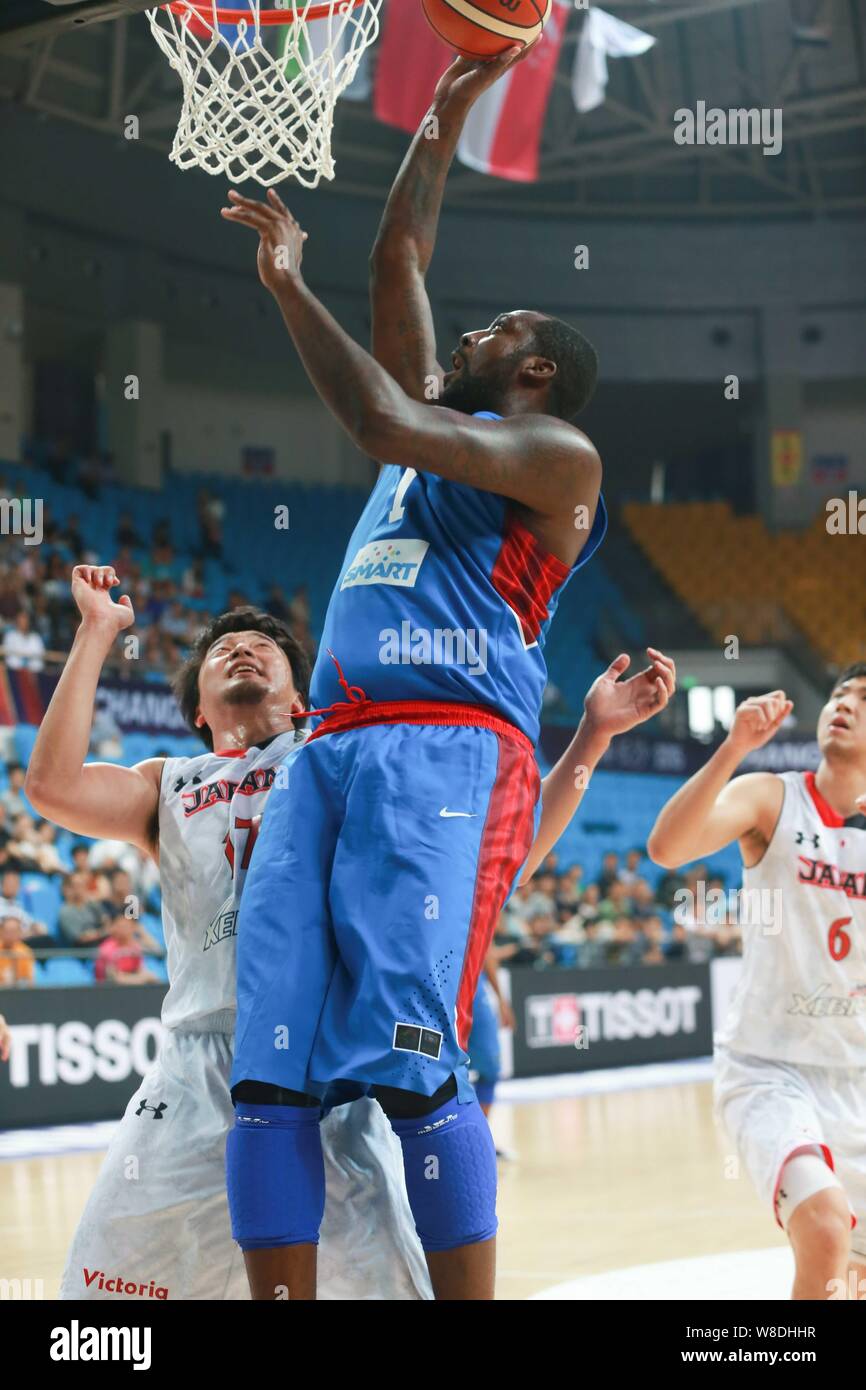 Andray Blatche of Philippines, right, drives to the basket against Gaku ...