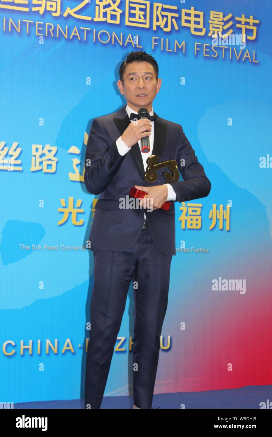 Hong Kong actor Andy Lau holds his trophy for the Best Actor award ...