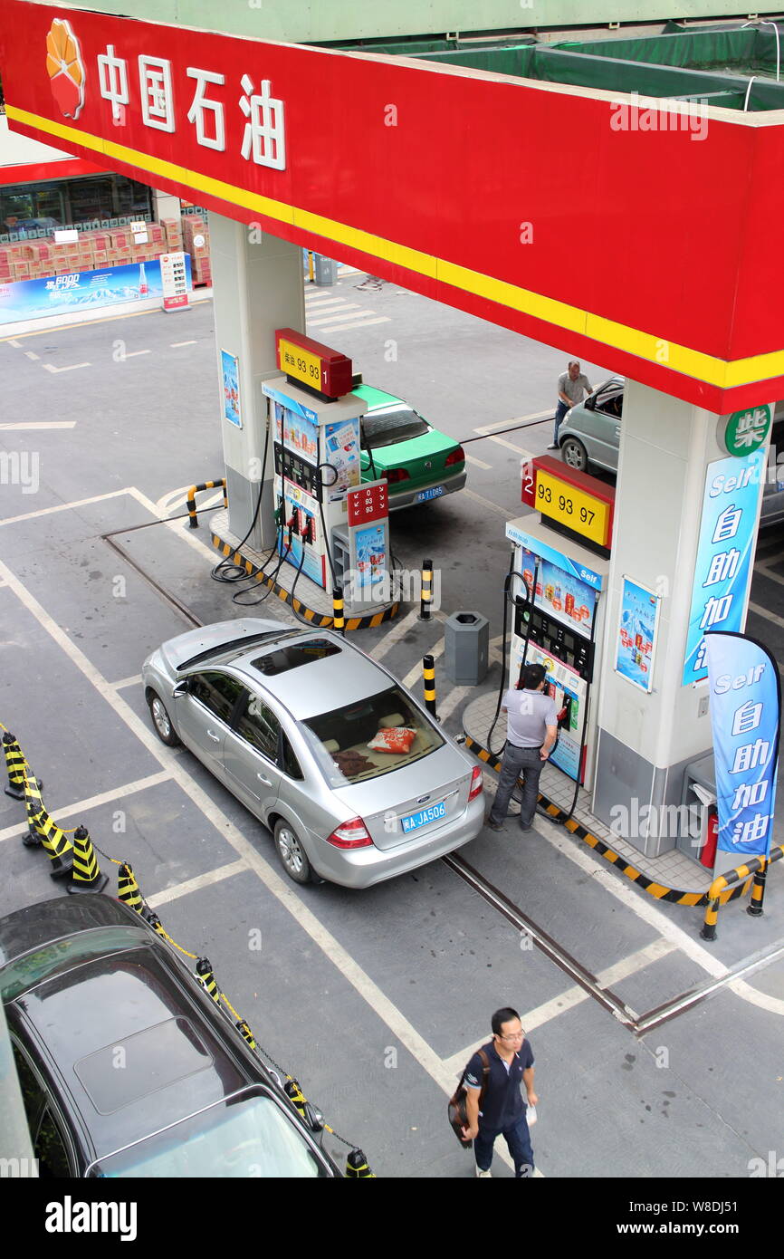 --FILE--A car is being refueled at a gas station of PetroChina, a ...