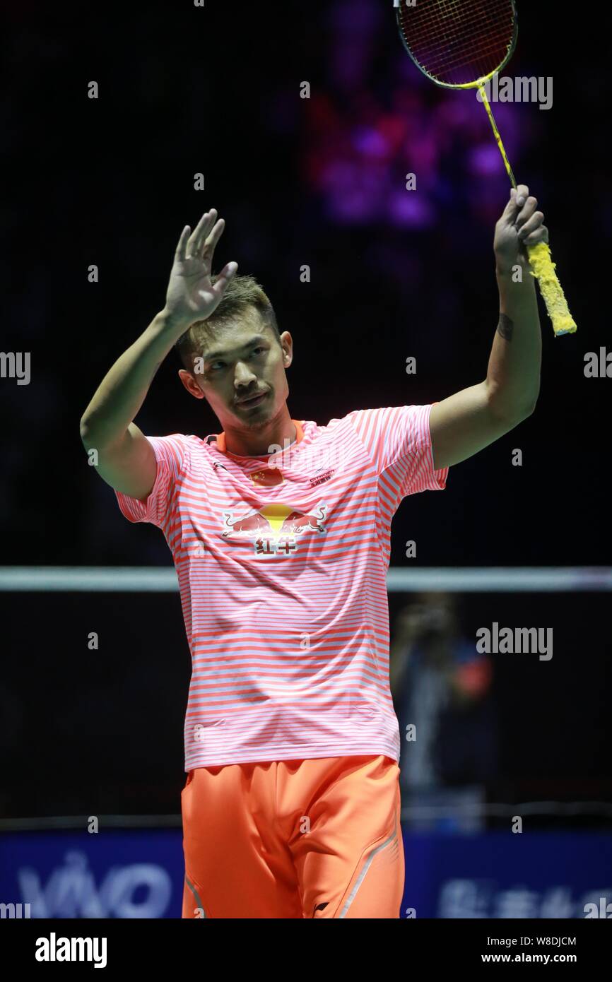 Lin Dan of China celebrates after defeating Takuma Ueda of Japan in ...