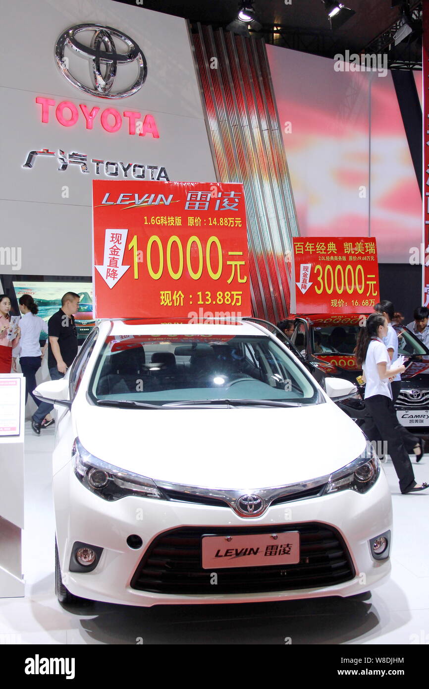 --FILE--Visitors look at Toyota cars on display during an auto show in ...