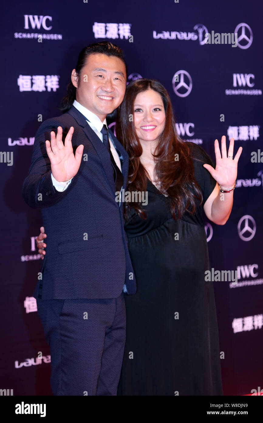 --FILE--Retired Chinese tennis star Li Na, right, and her husband Jiang ...