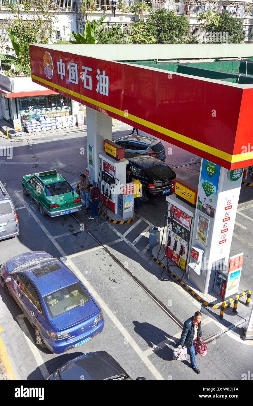 --FILE--Cars are being refueled at a gas station of PetroChina, a ...