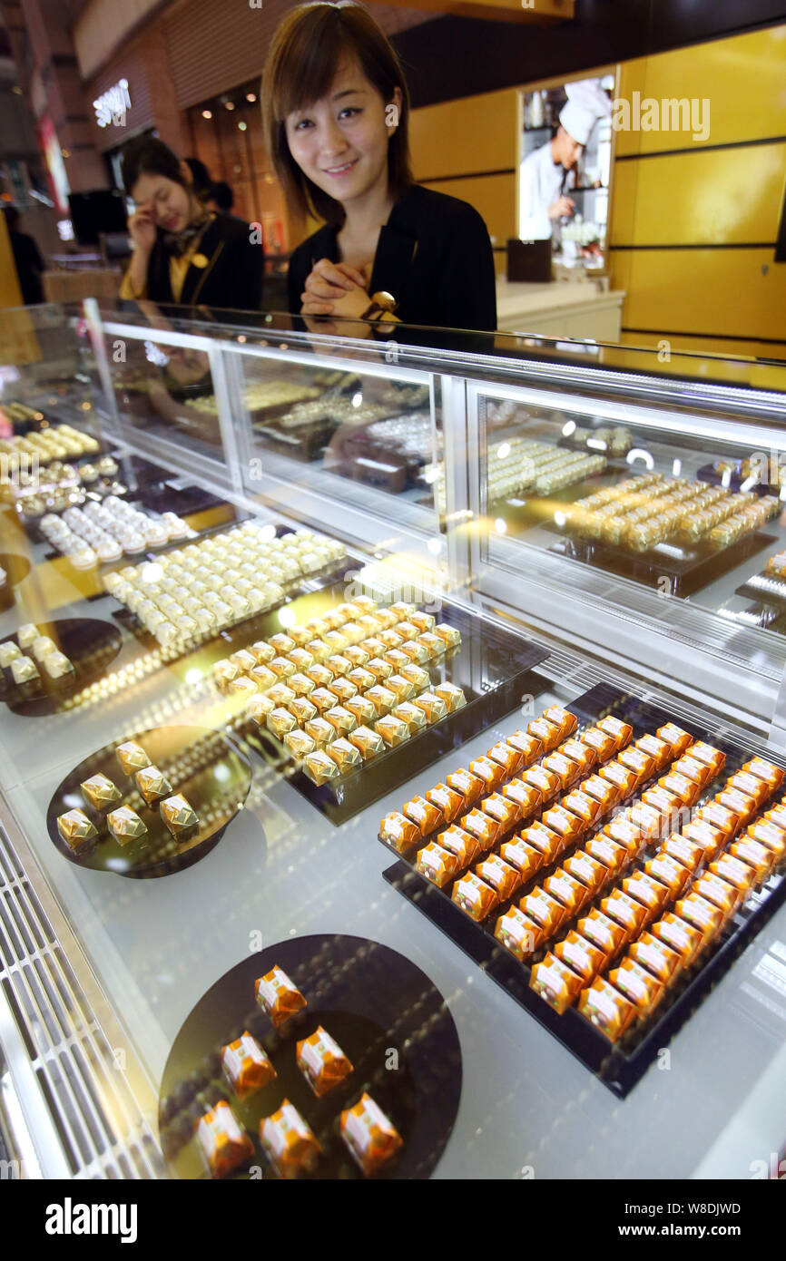 --FILE--Chinese employees sell chocolates at a Ferrero boutique of ...
