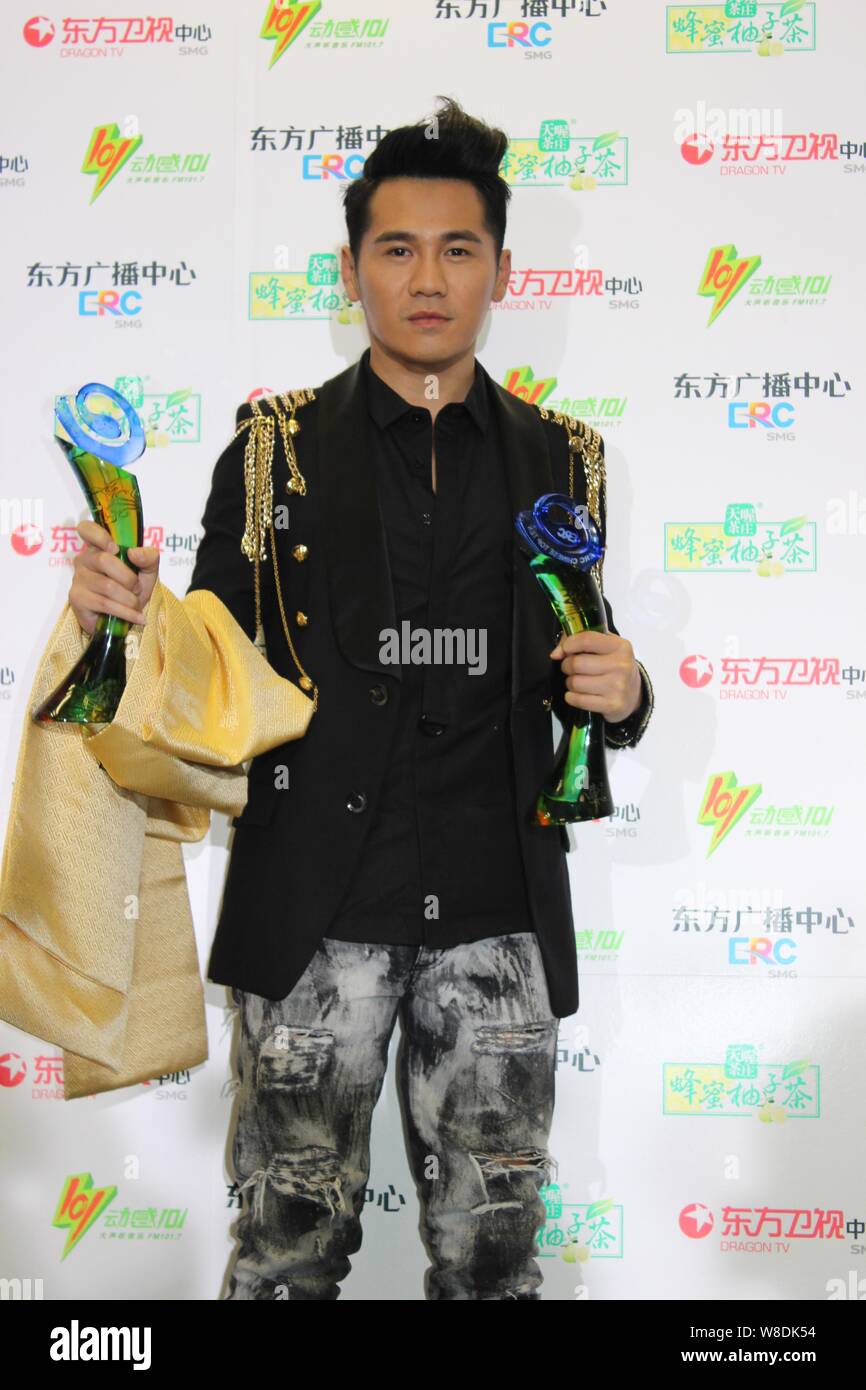 Taiwanese singer Gary Chaw poses with his trophies during the 22th ...