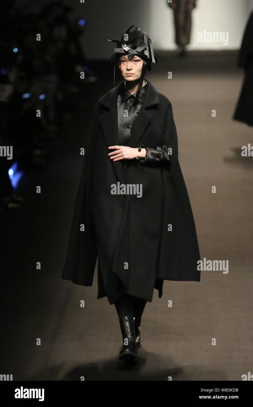 A model displays a new creation at the Zhang Yuhao fashion show during ...