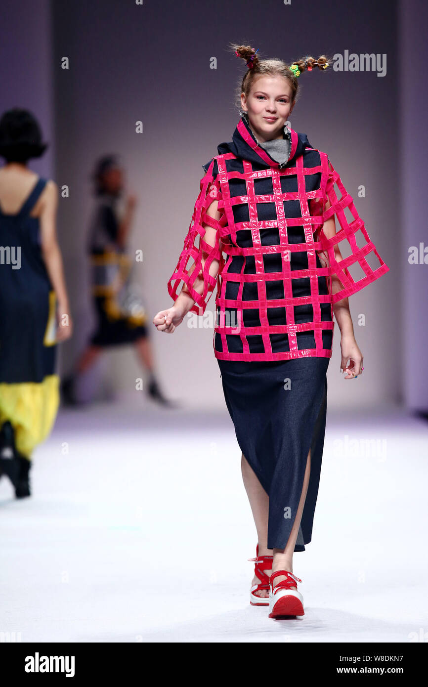 A model displays a new creation by Chinese designer Dong Liang at the ...