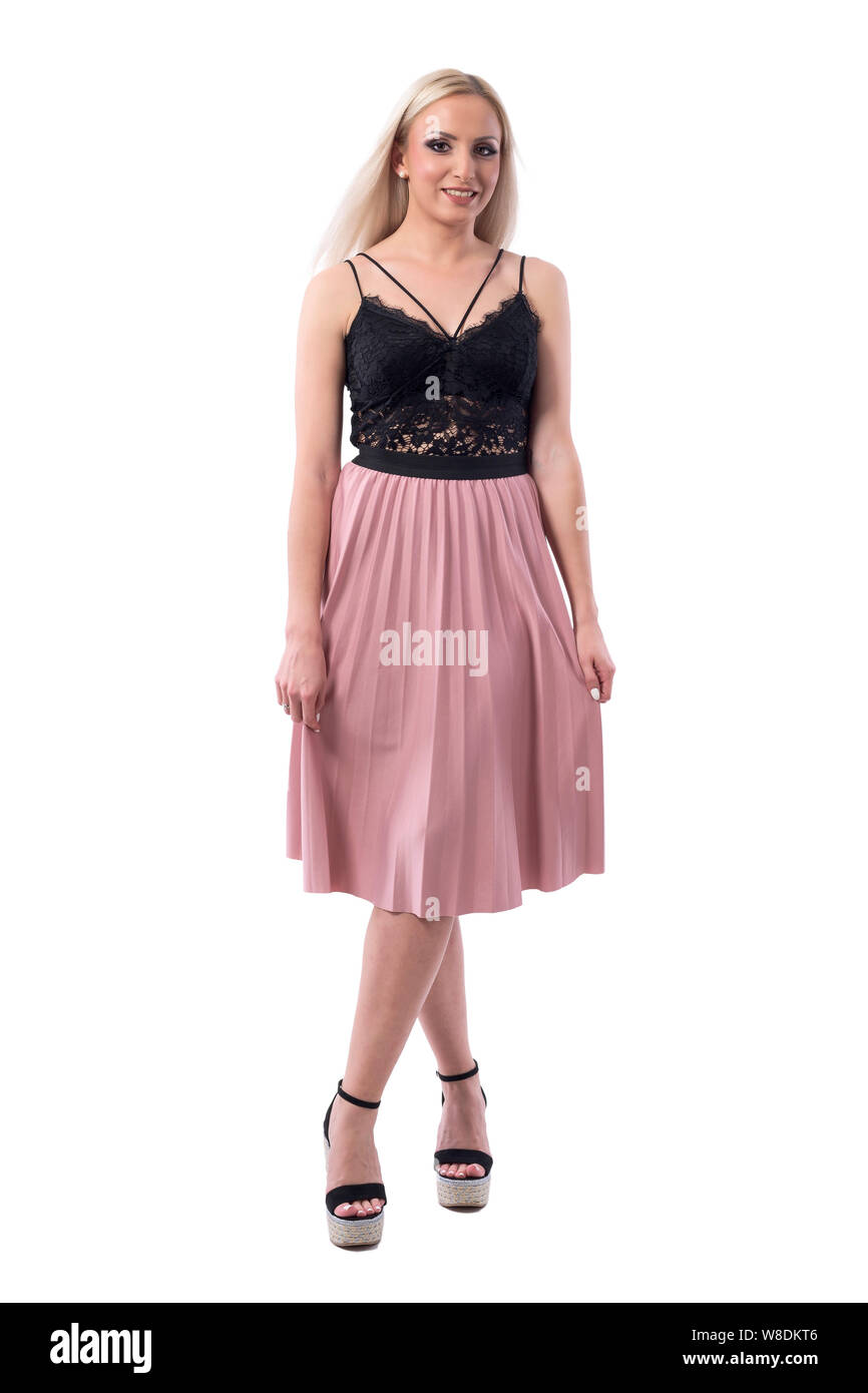 Beautiful blonde tender affectionate woman holding pleated skirt ...