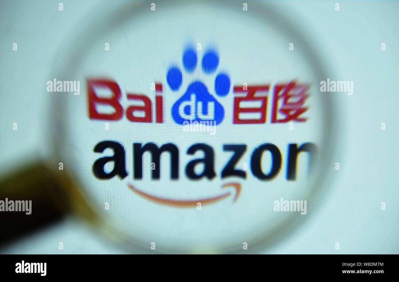 A netizen browses the logos of Chinese online search giant Baidu and e ...