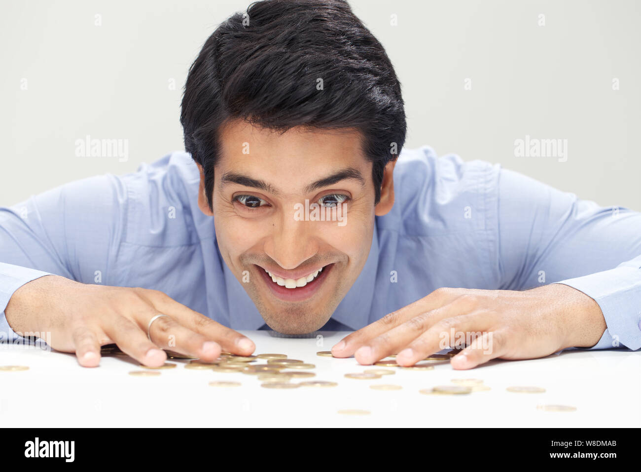 Businessman excitingly looking money and smiling Stock Photo - Alamy