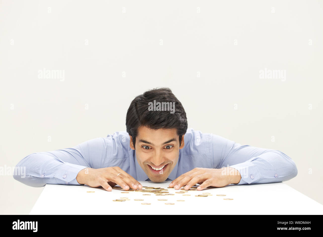 Businessman grabbing money and smiling Stock Photo - Alamy