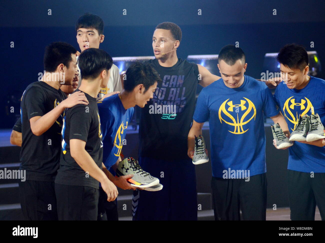 NBA star Stephen Curry, center, poses during a fan meeting event in ...
