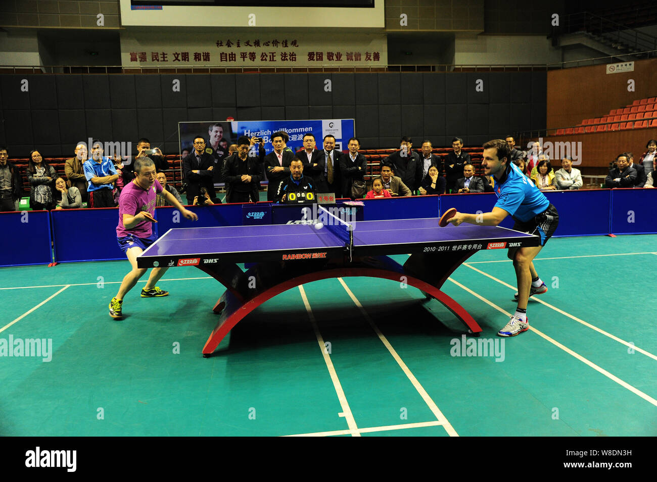 German table tennis player Timo Boll, right, competes with a Chinese ...