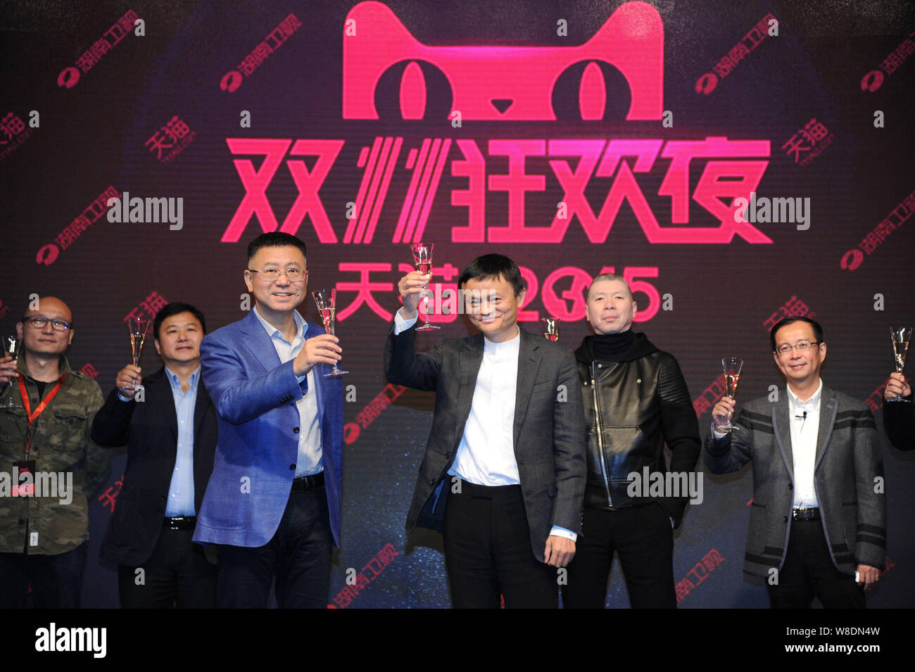 Jack Ma Yun, center, Chairman of Alibaba Group, toasts during a press conference for the 2015 ...