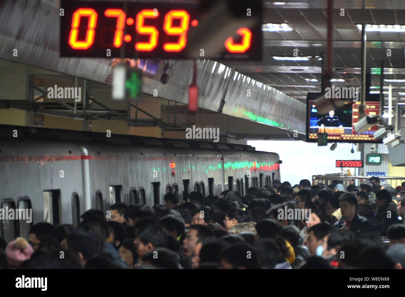 --FILE--Passengers queue up to board a subway train at a metro station ...